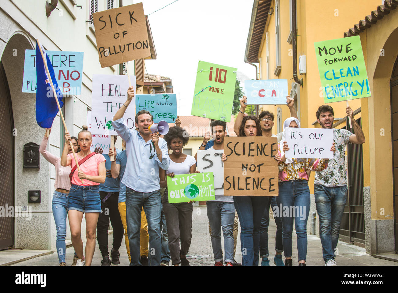 Group of activists is protesting outdoors - Crowd demonstrating against ...