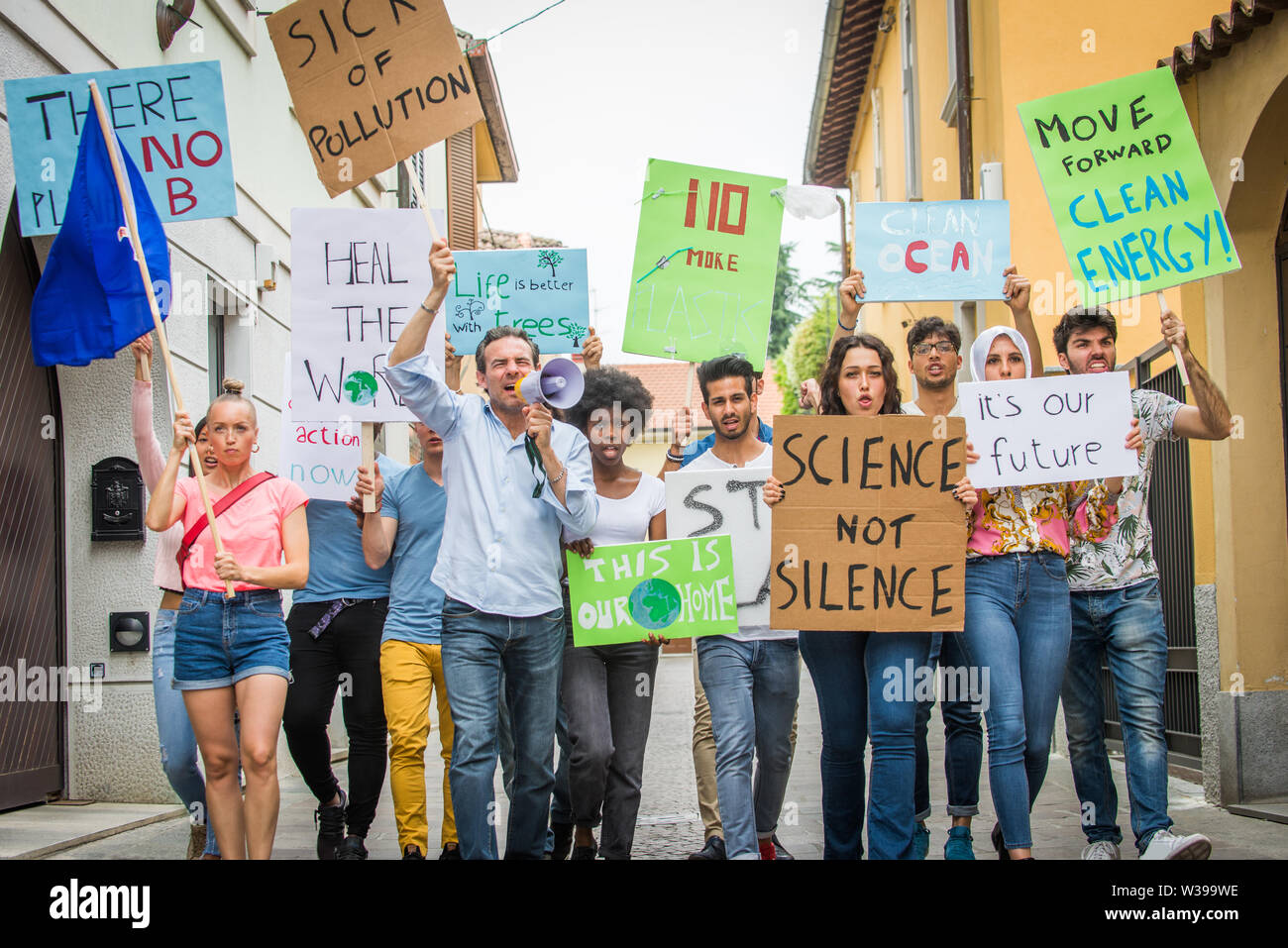 Group of activists is protesting outdoors - Crowd demonstrating against ...