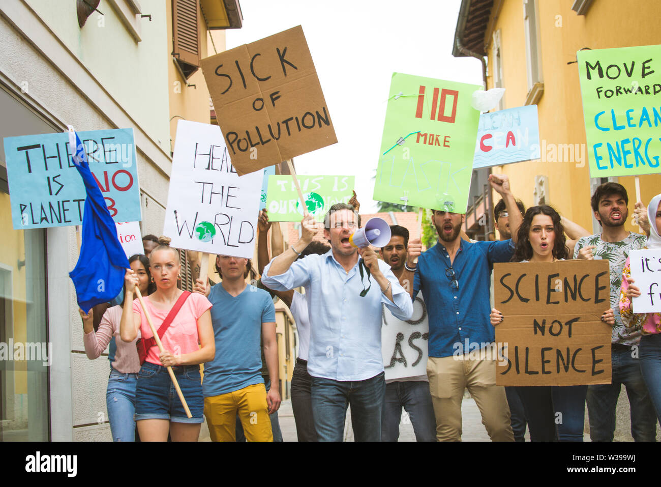 Group of activists is protesting outdoors - Crowd demonstrating against ...