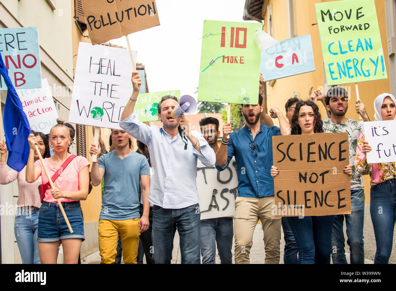 Group of activists is protesting outdoors - Crowd demonstrating against ...