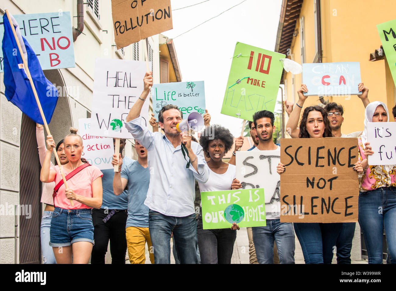 Group of activists is protesting outdoors - Crowd demonstrating against ...