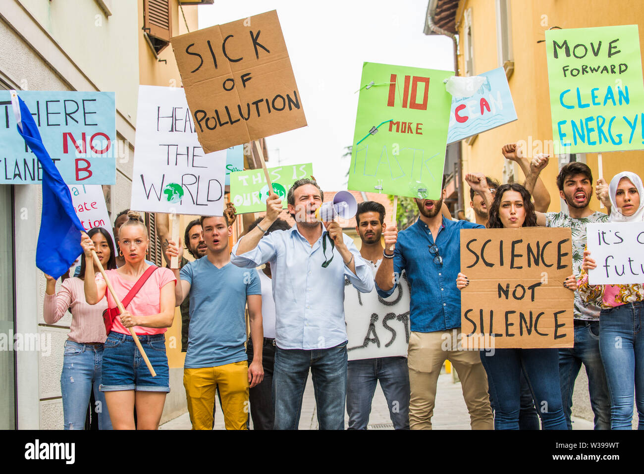 Group of activists is protesting outdoors - Crowd demonstrating against ...