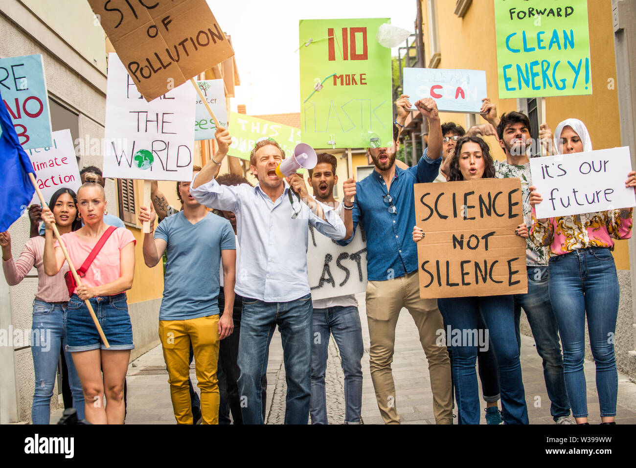 Group of activists is protesting outdoors - Crowd demonstrating against ...