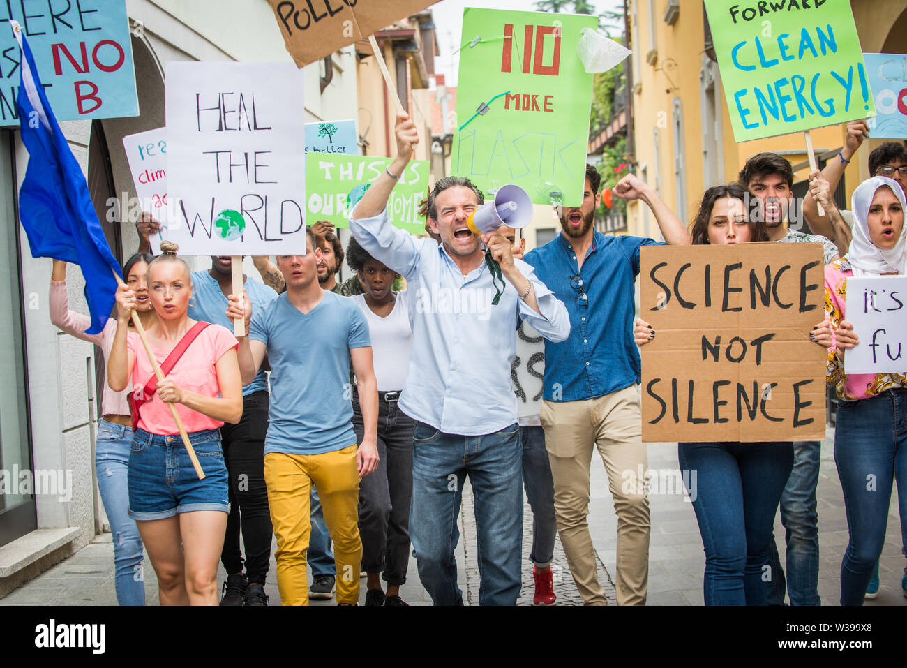 Group of activists is protesting outdoors - Crowd demonstrating against ...
