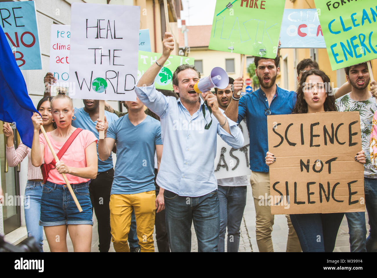 Group of activists is protesting outdoors - Crowd demonstrating against ...