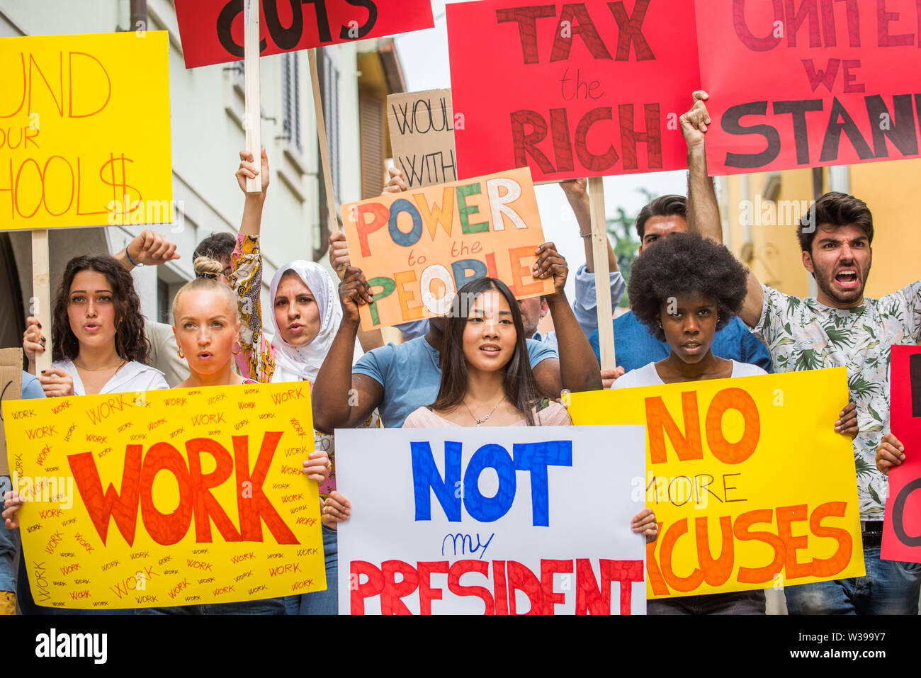 Group of activists is protesting outdoors - Crowd demonstrating against ...