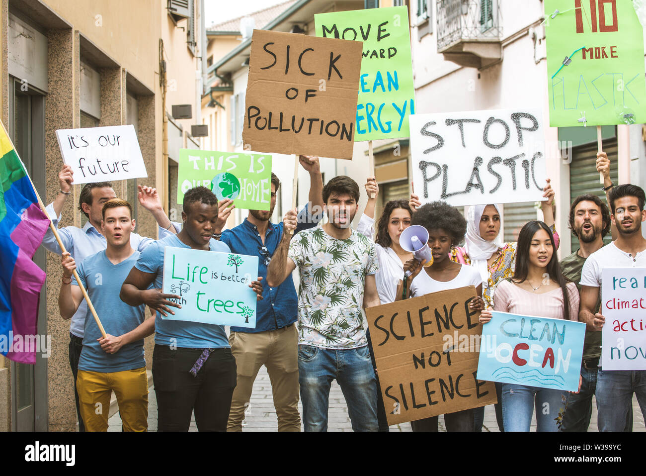 Group of activists is protesting outdoors - Crowd demonstrating against ...