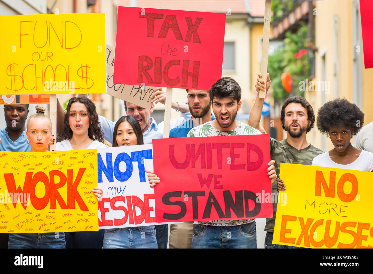 Group of activists is protesting outdoors - Crowd demonstrating against ...