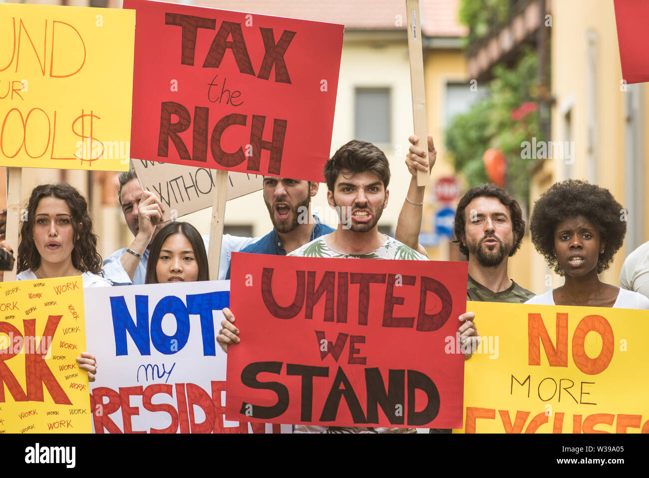 Group of activists is protesting outdoors - Crowd demonstrating against ...