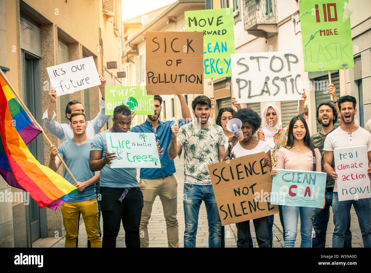 Group of activists is protesting outdoors - Crowd demonstrating against ...