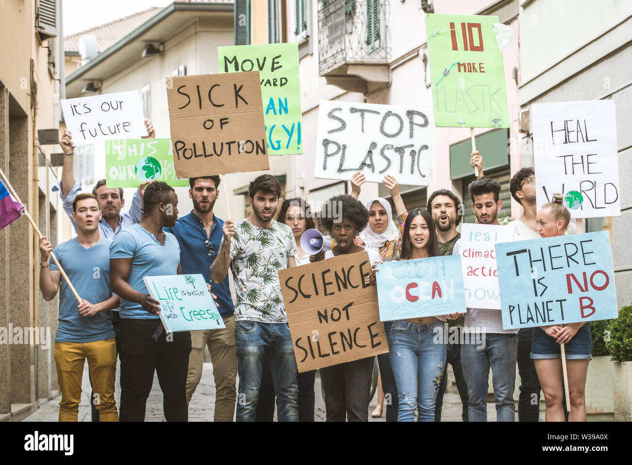Group of activists is protesting outdoors - Crowd demonstrating against ...
