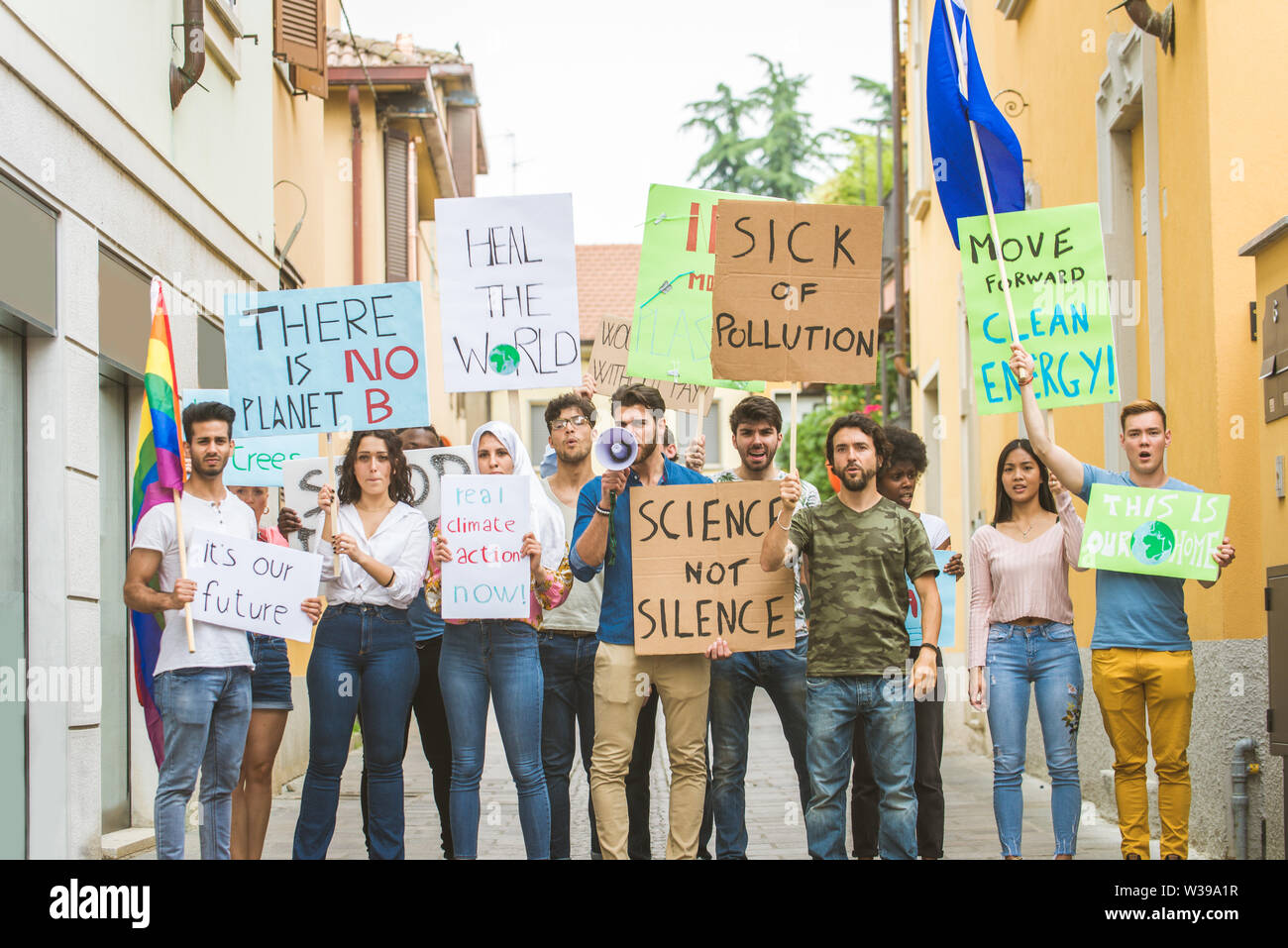 Group of activists is protesting outdoors - Crowd demonstrating against ...