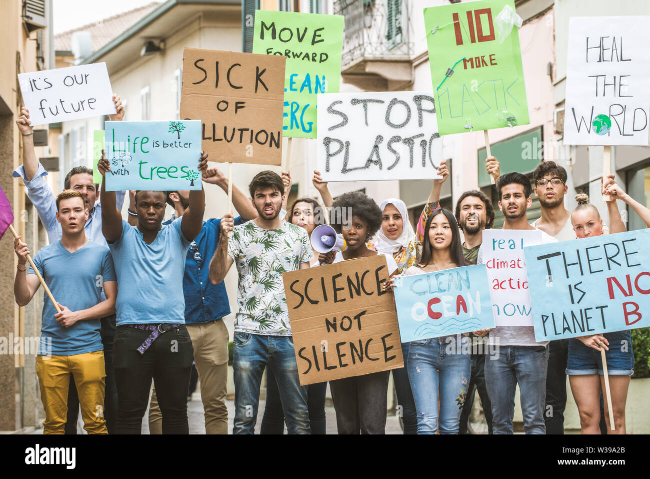 Group of activists is protesting outdoors - Crowd demonstrating against ...