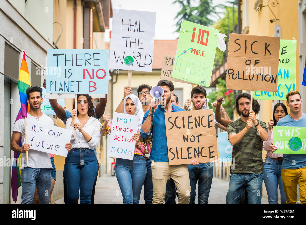 Group of activists is protesting outdoors - Crowd demonstrating against ...