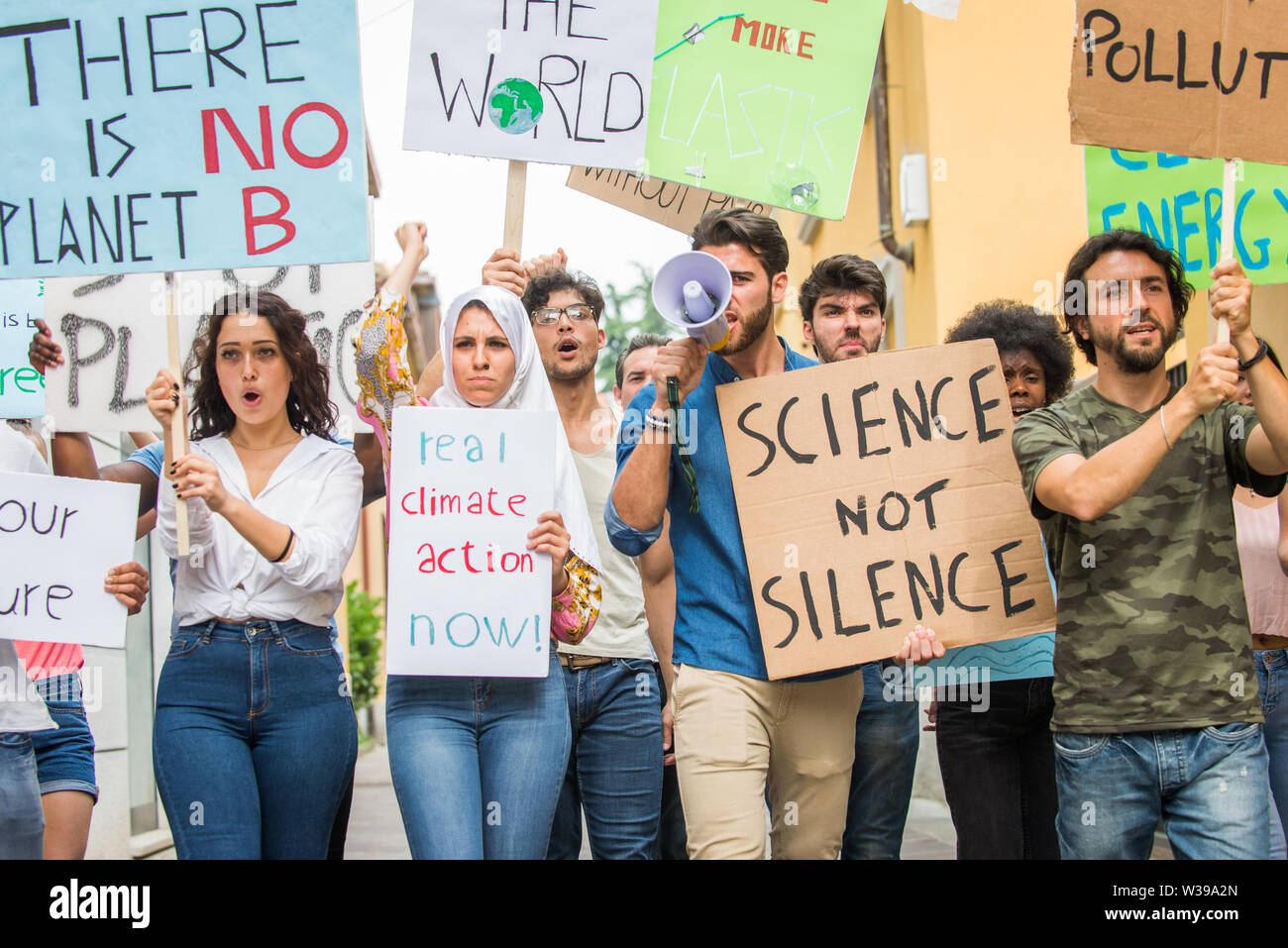 Group of activists is protesting outdoors - Crowd demonstrating against ...
