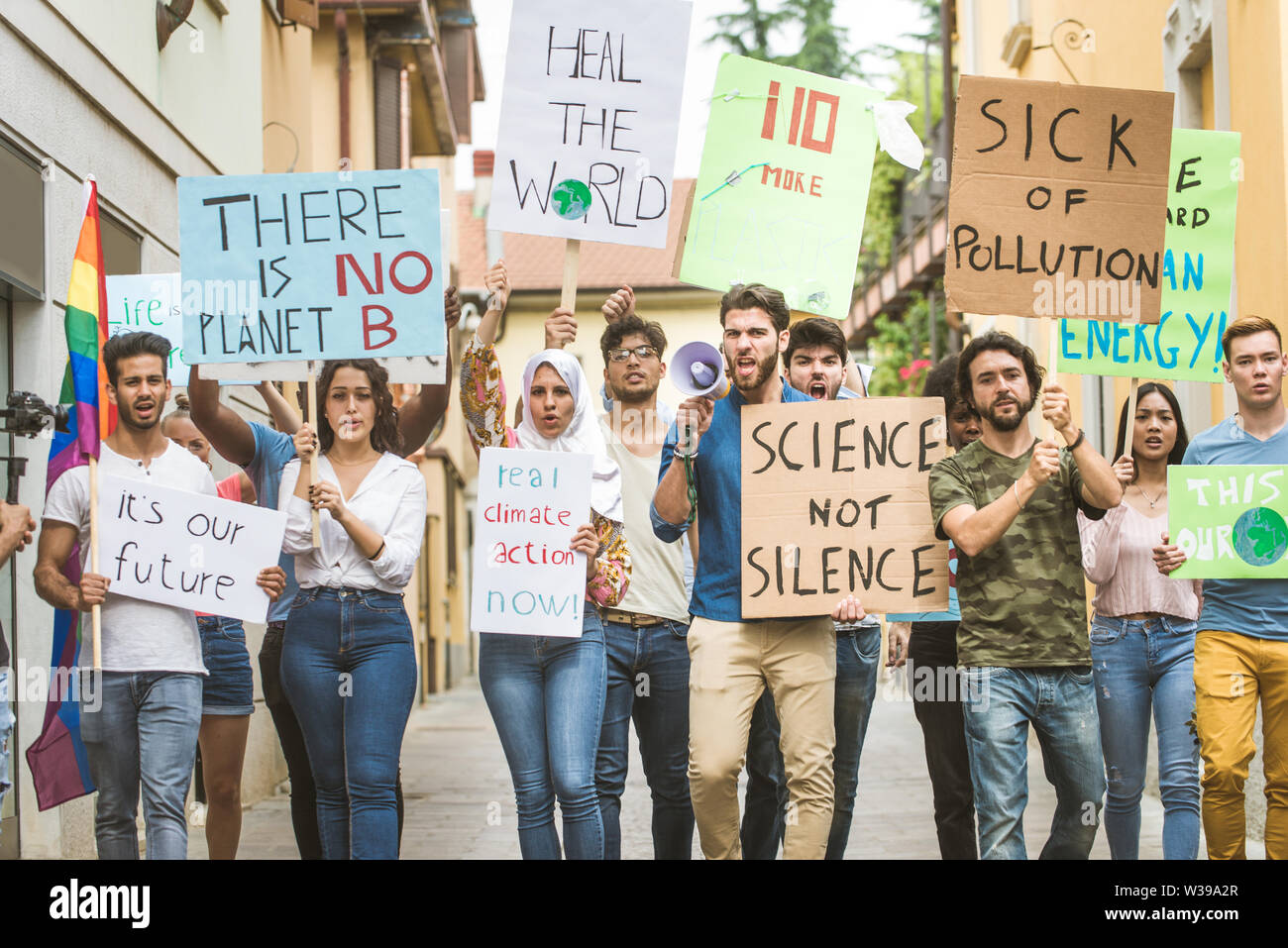 Group of activists is protesting outdoors - Crowd demonstrating against ...