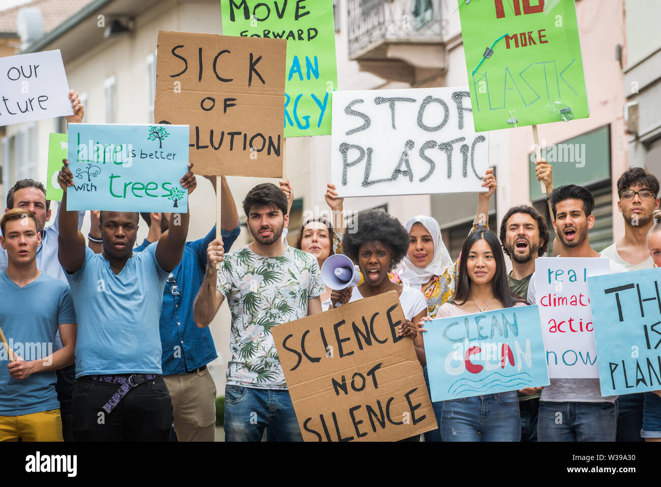 Group of activists is protesting outdoors - Crowd demonstrating against ...