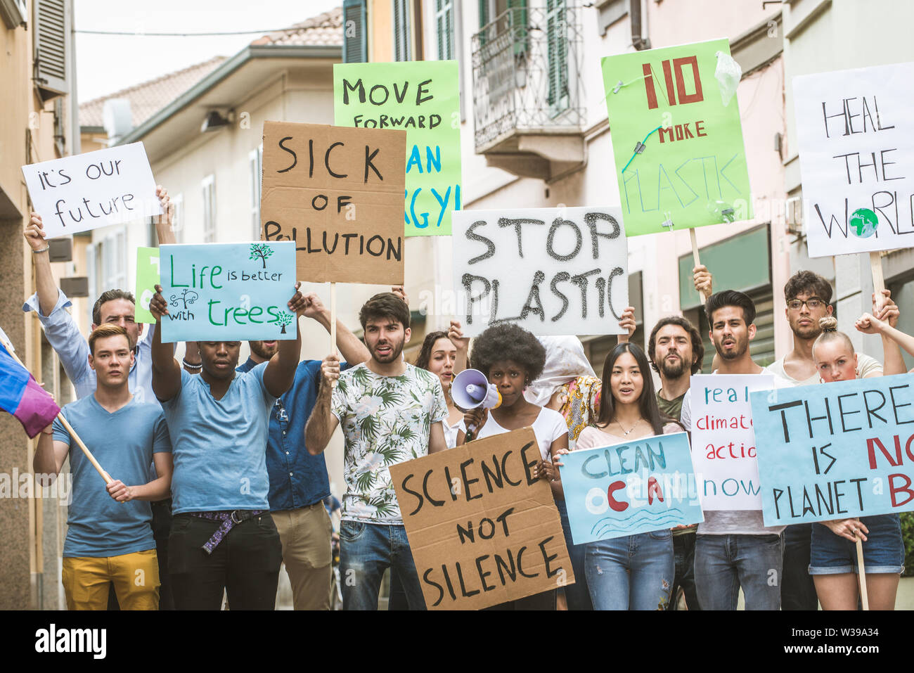 Group of activists is protesting outdoors - Crowd demonstrating against ...