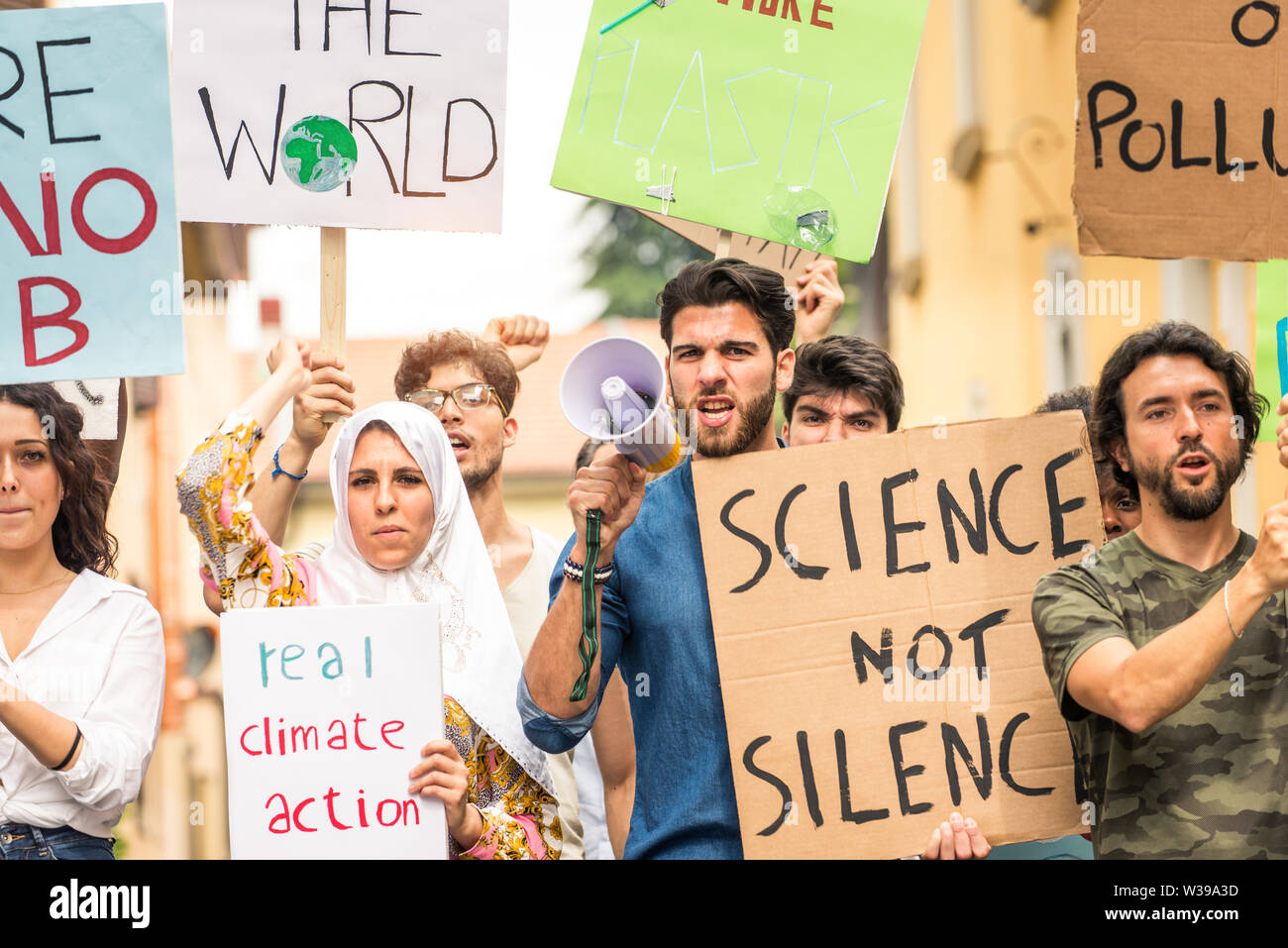 Group of activists is protesting outdoors - Crowd demonstrating against ...