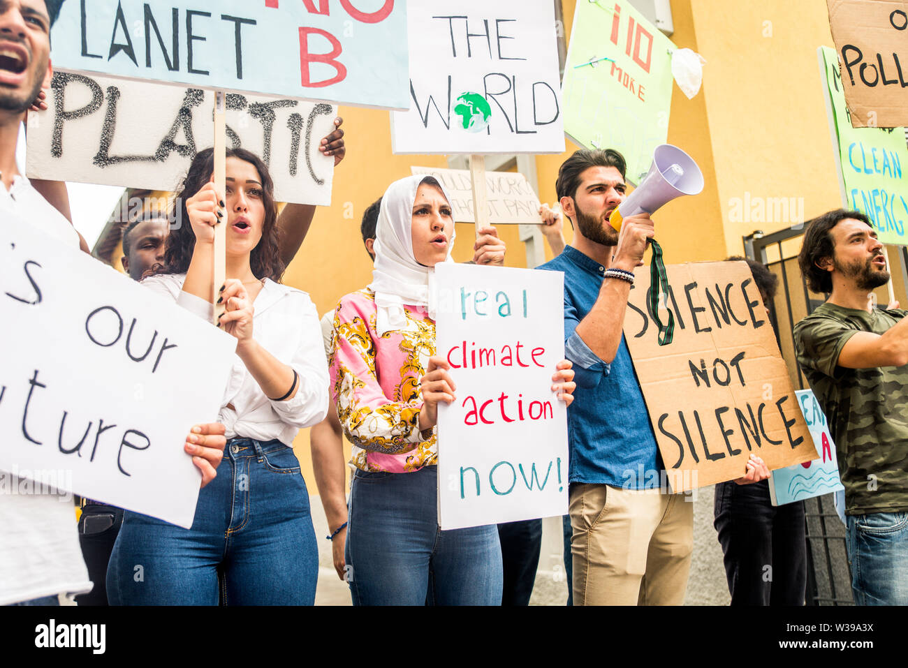 Group of activists is protesting outdoors - Crowd demonstrating against ...