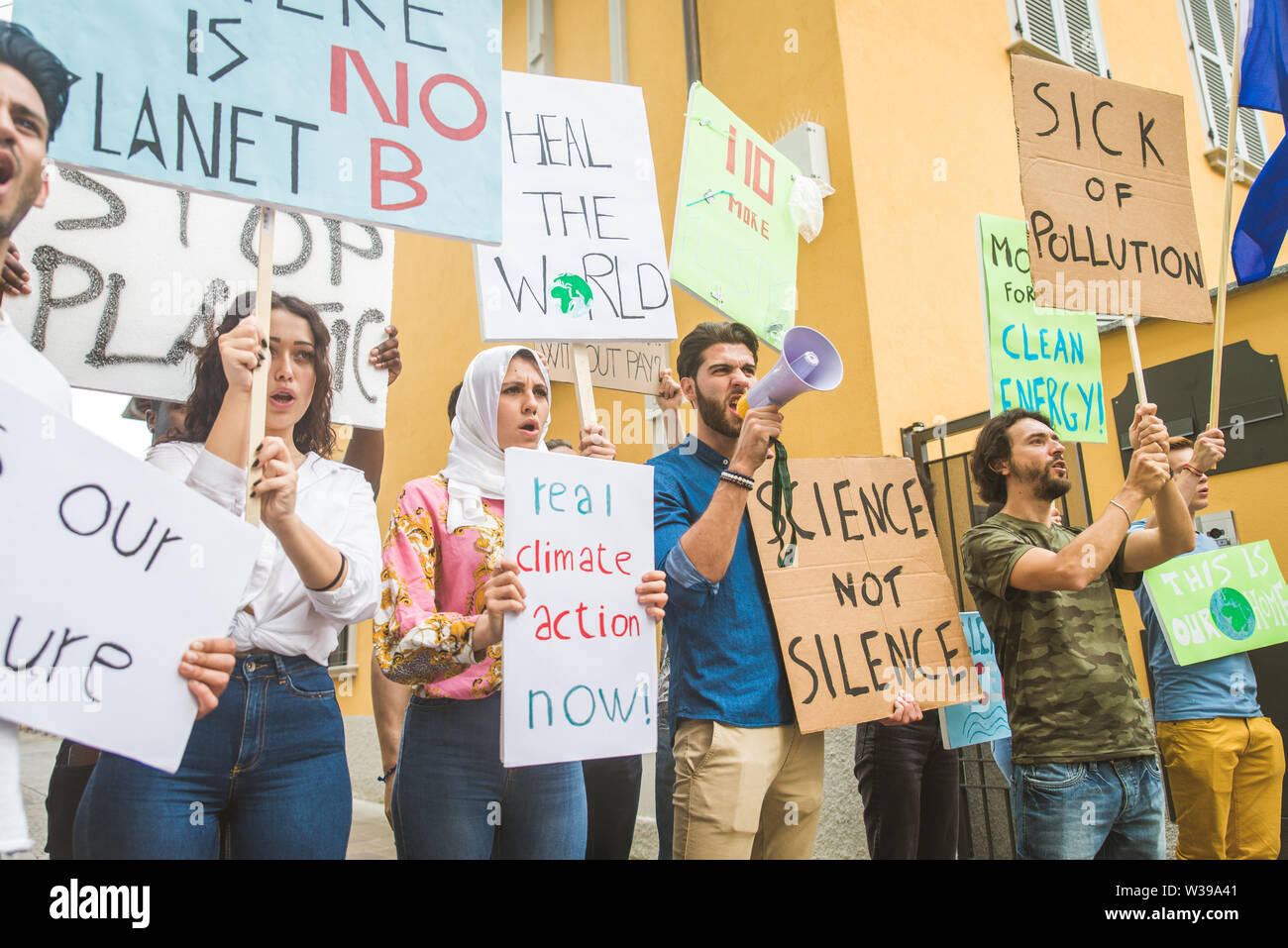 Group of activists is protesting outdoors - Crowd demonstrating against ...