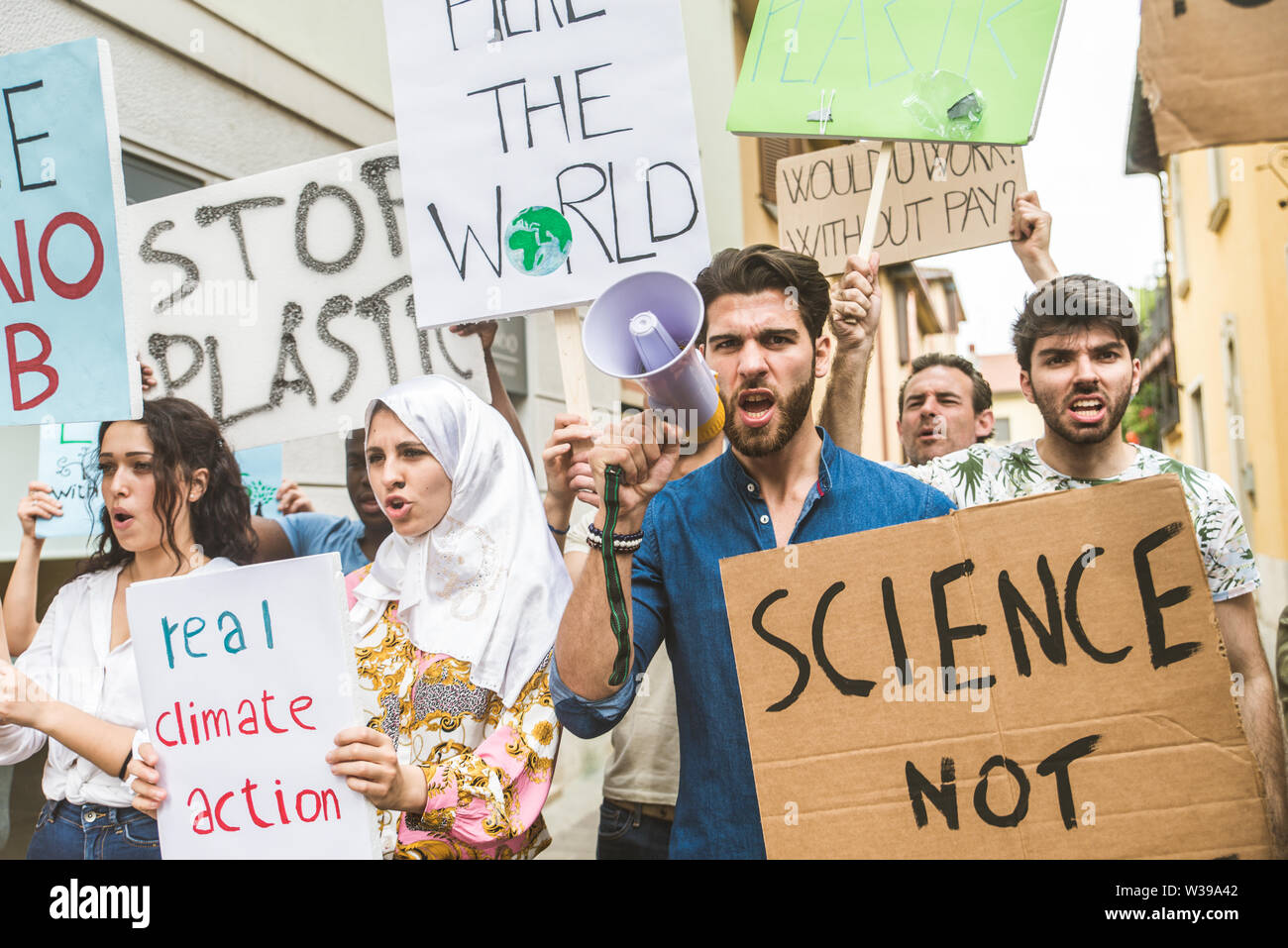 Group of activists is protesting outdoors - Crowd demonstrating against ...
