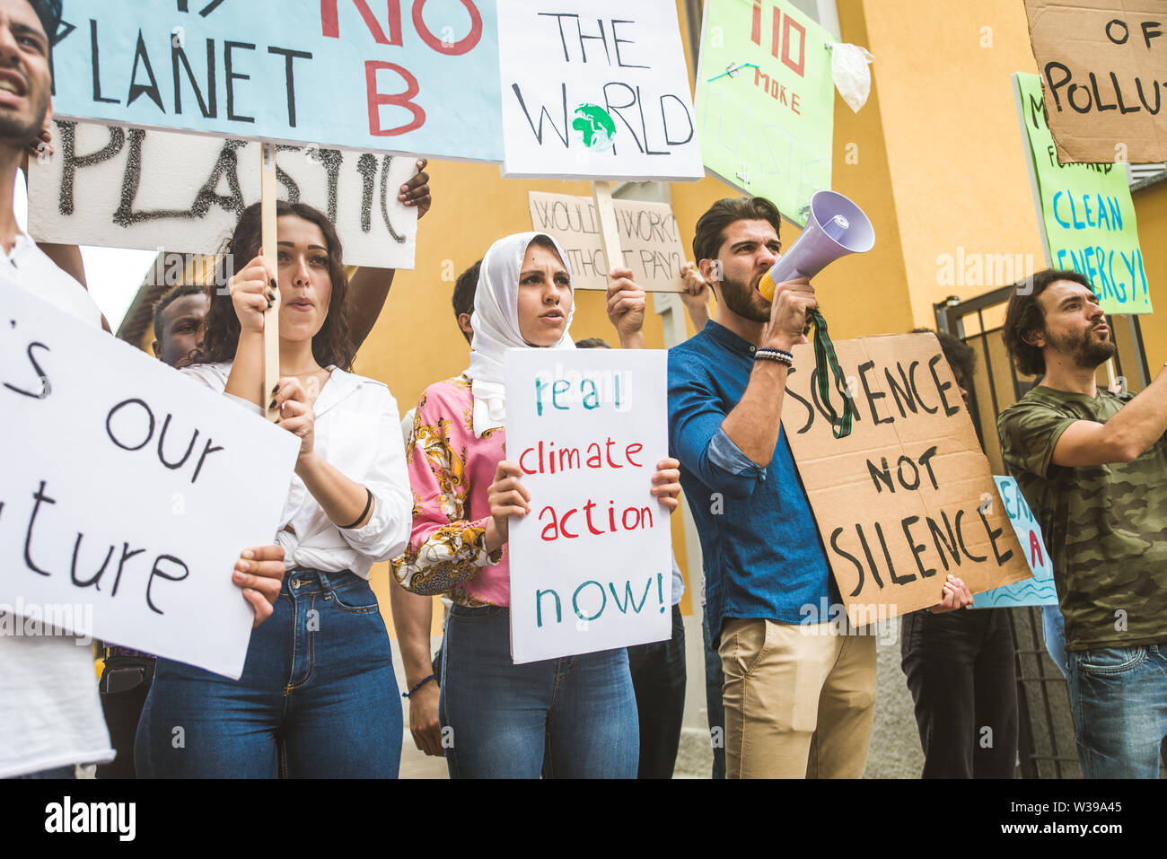 Group of activists is protesting outdoors - Crowd demonstrating against ...
