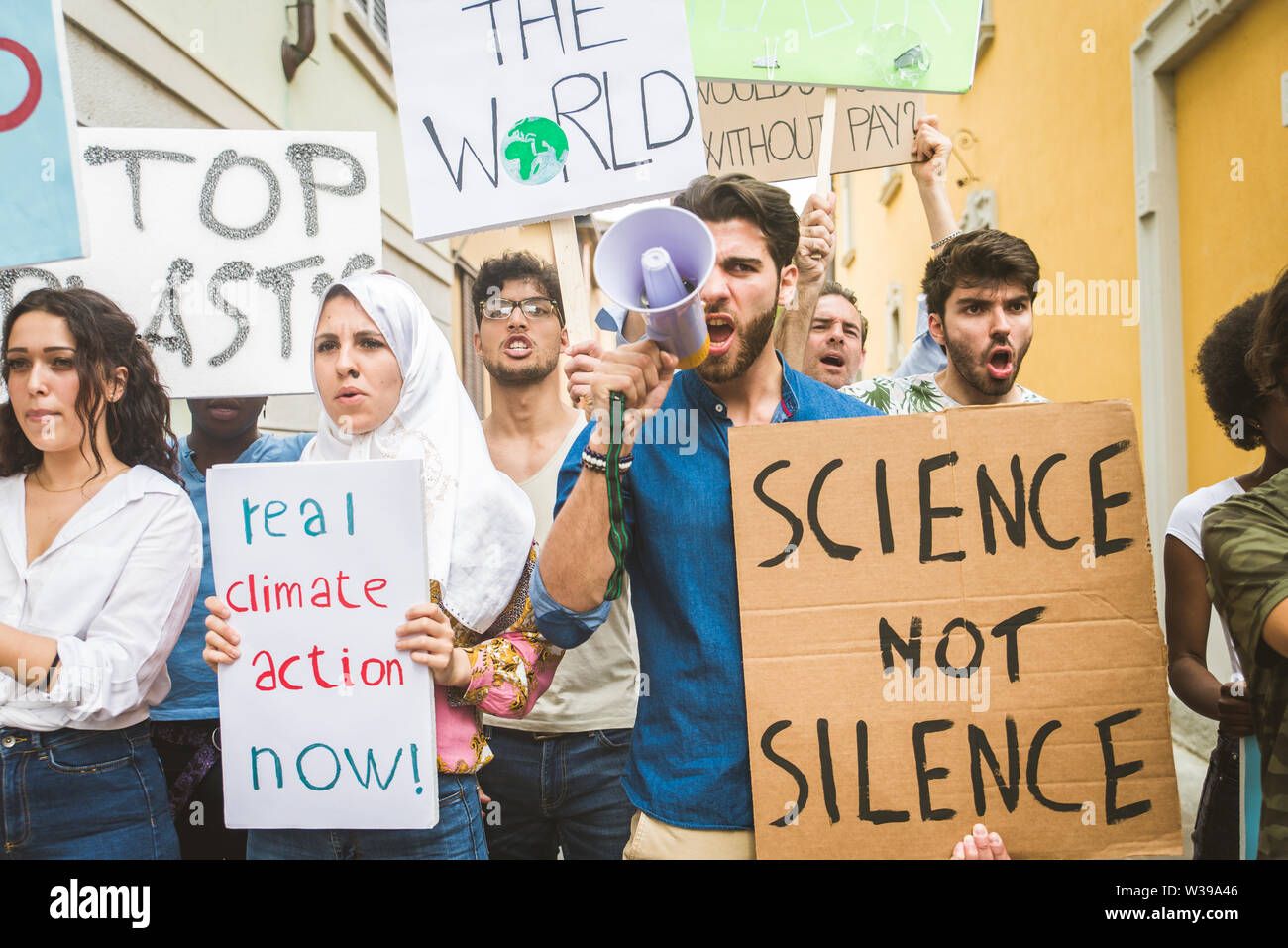 Group of activists is protesting outdoors - Crowd demonstrating against ...