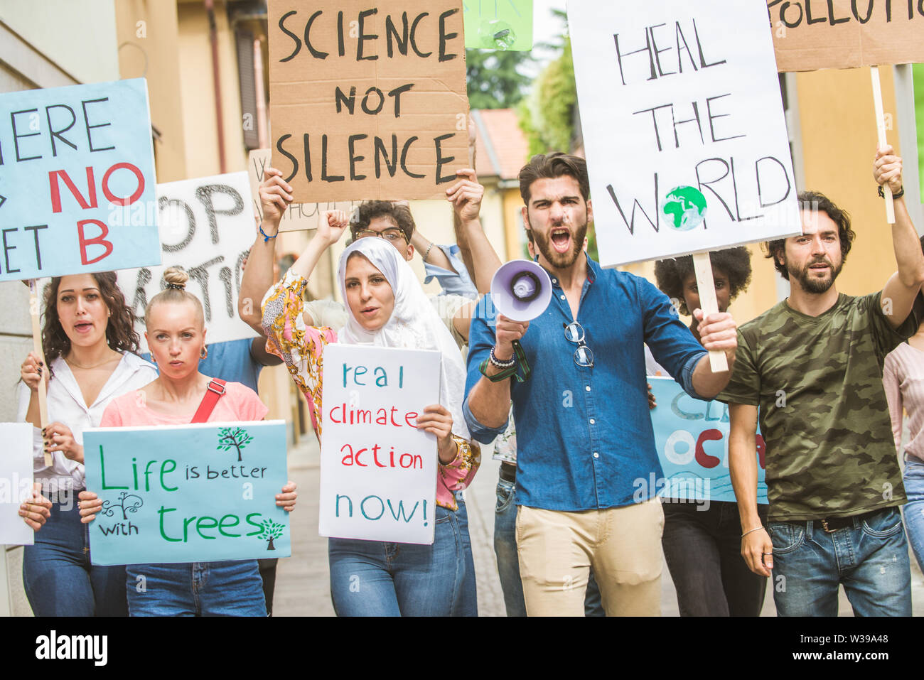 Group of activists is protesting outdoors - Crowd demonstrating against ...