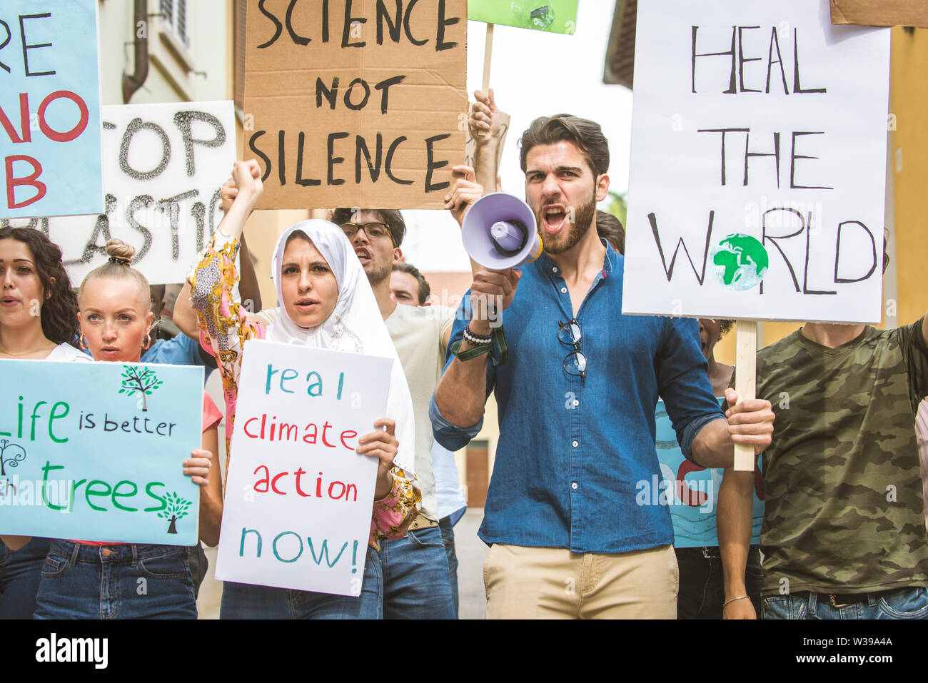 Group of activists is protesting outdoors - Crowd demonstrating against ...
