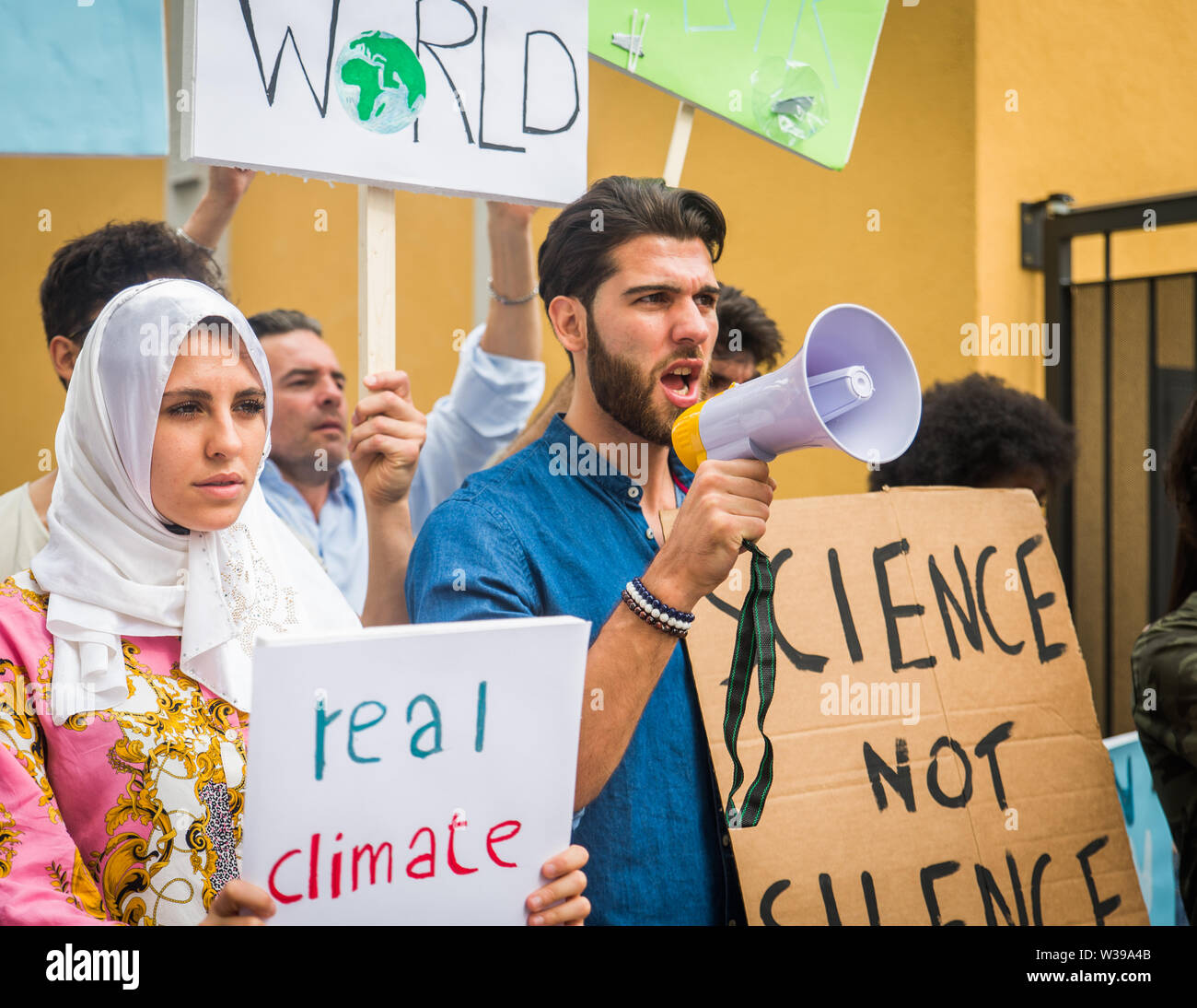 Group of activists is protesting outdoors - Crowd demonstrating against ...