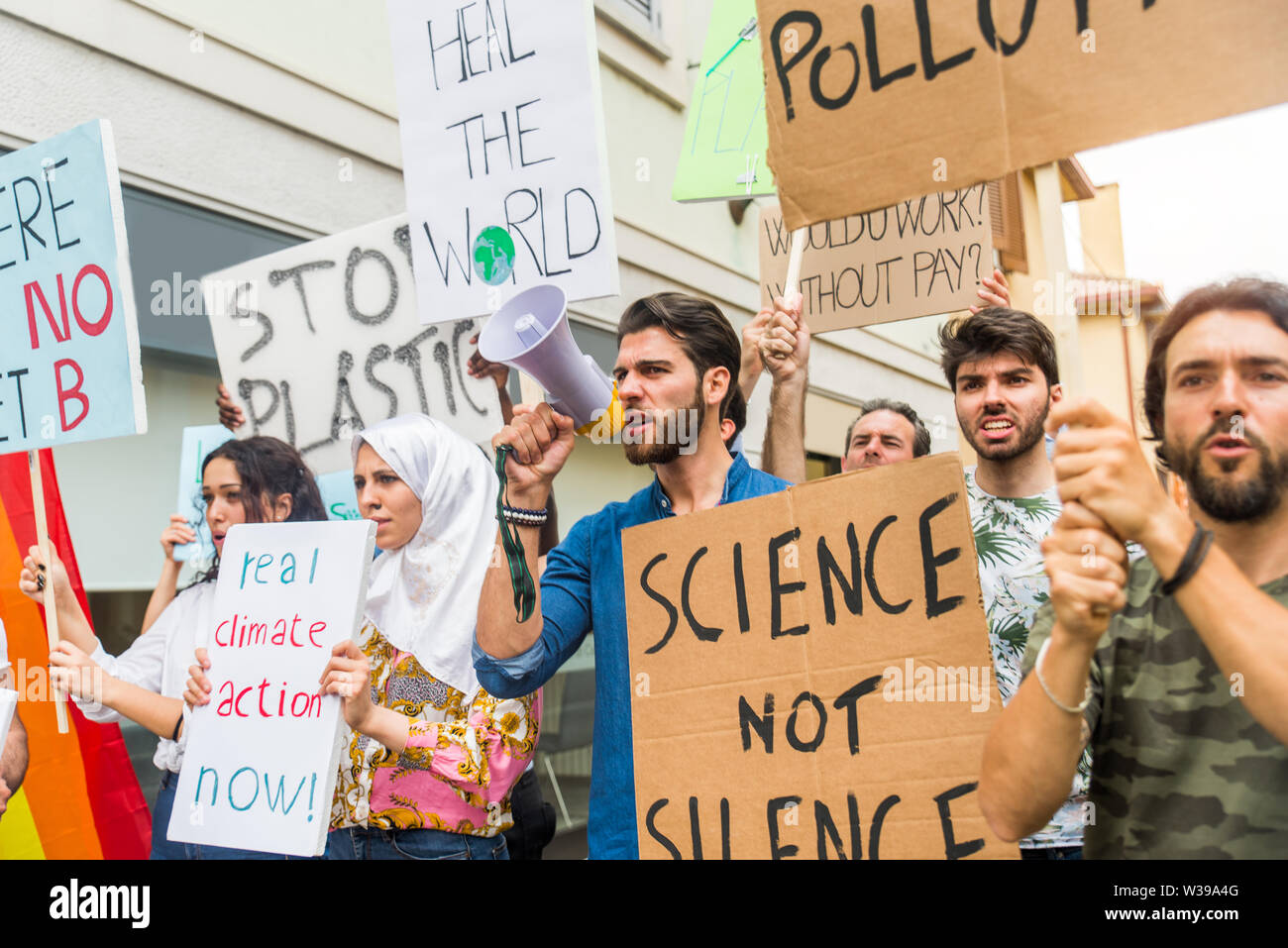 Group of activists is protesting outdoors - Crowd demonstrating against ...