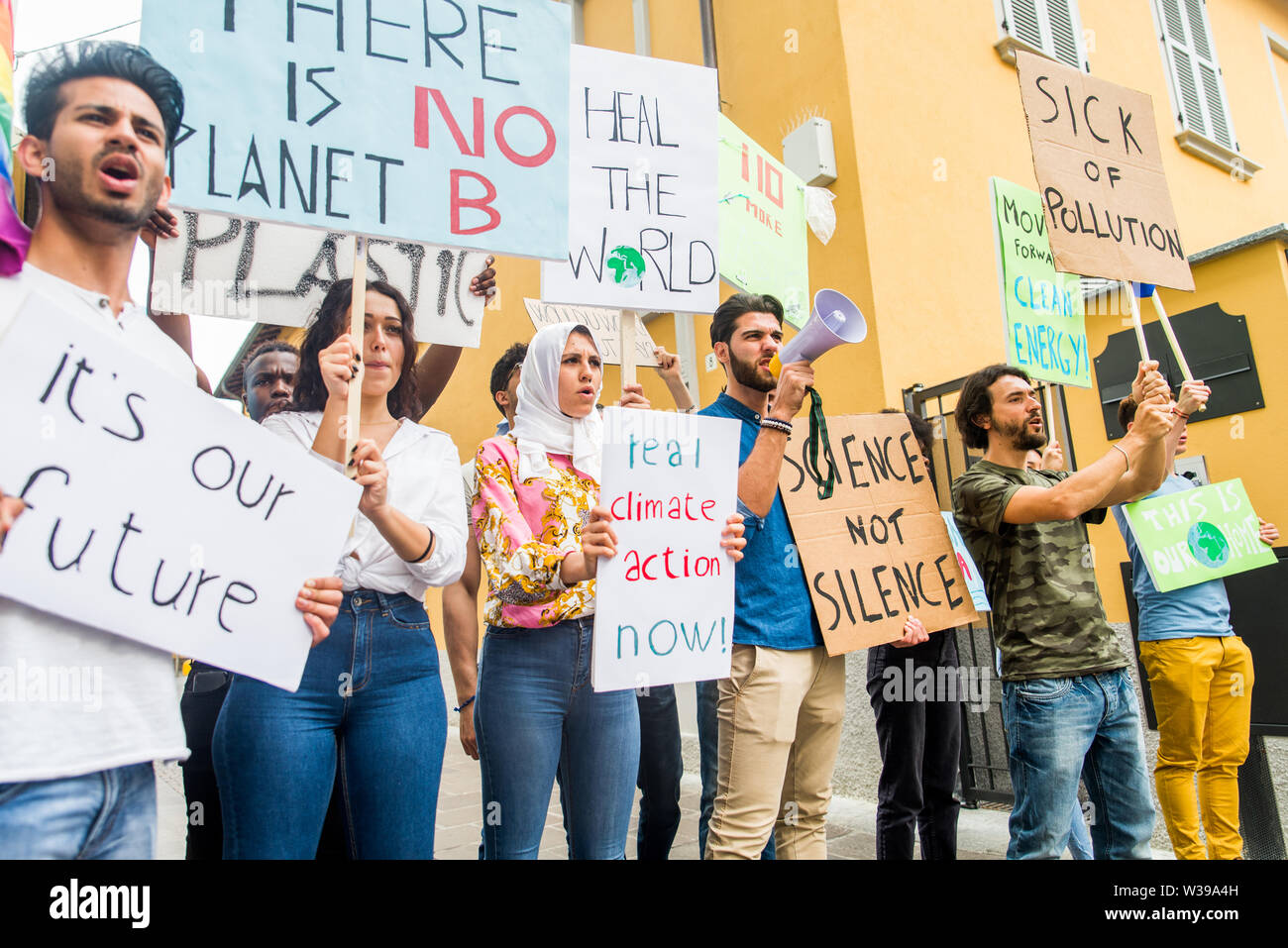 Group of activists is protesting outdoors - Crowd demonstrating against ...