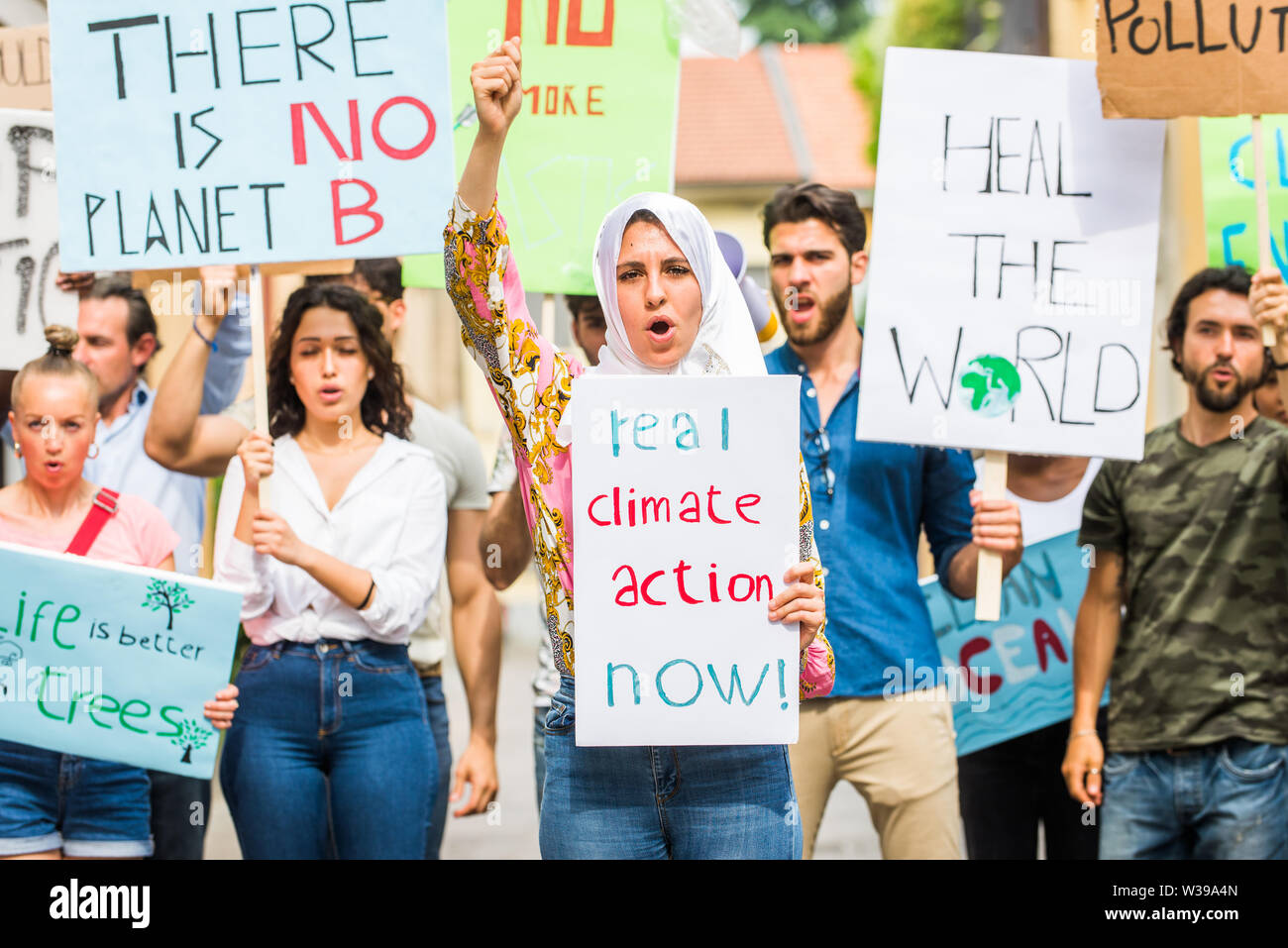 Group of activists is protesting outdoors - Crowd demonstrating against ...