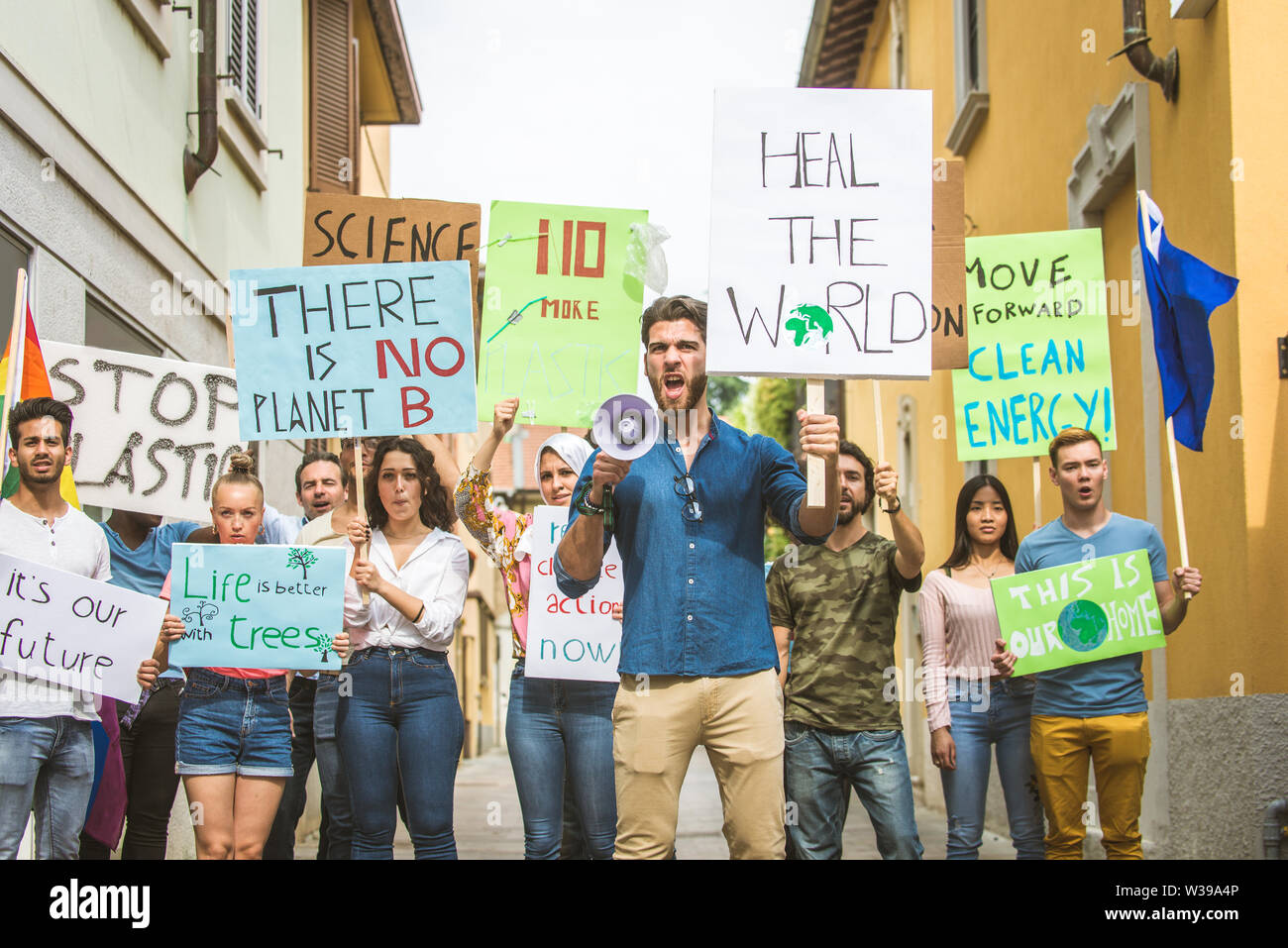 Group of activists is protesting outdoors - Crowd demonstrating against ...