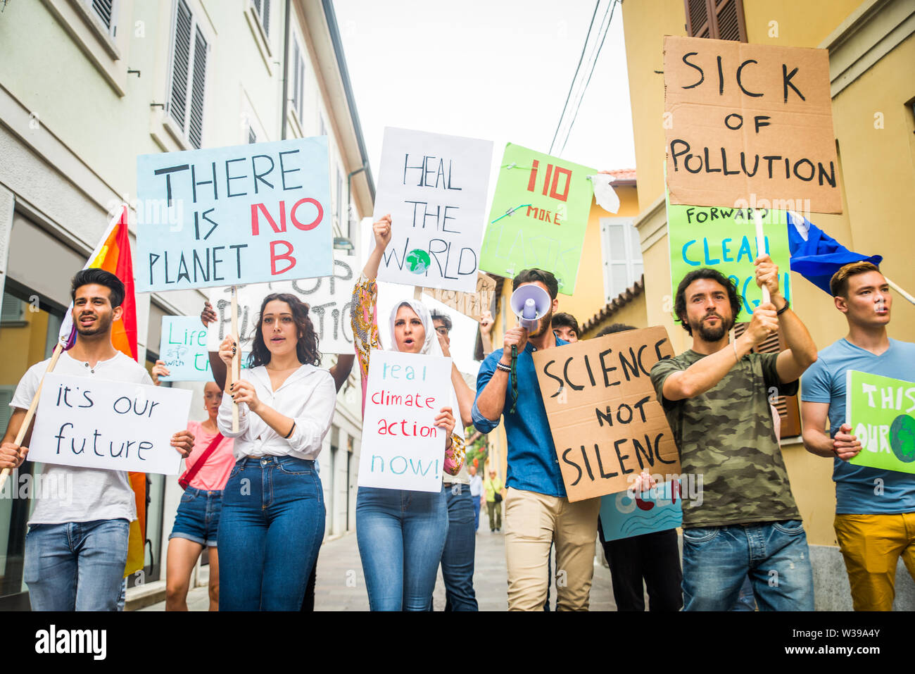 Group of activists is protesting outdoors - Crowd demonstrating against ...