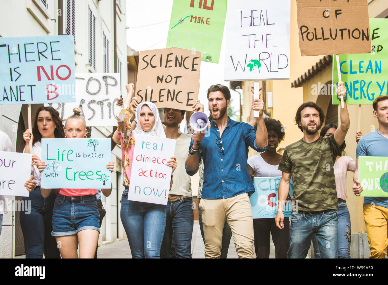 Group of activists is protesting outdoors - Crowd demonstrating against ...