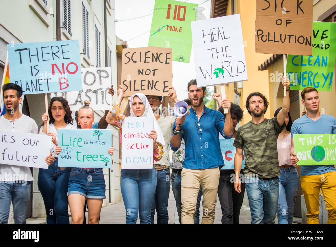Group of activists is protesting outdoors - Crowd demonstrating against ...