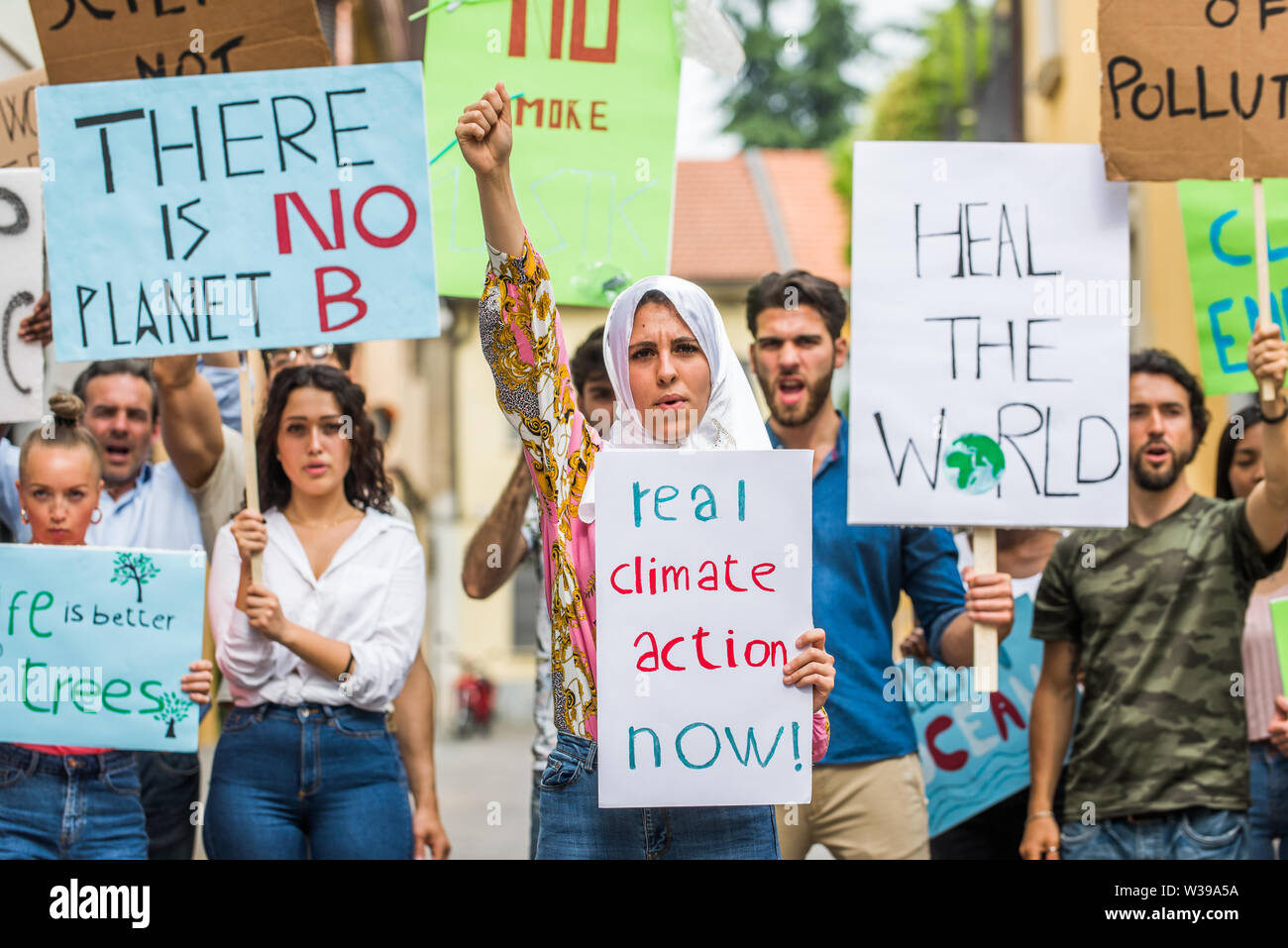 Group of activists is protesting outdoors - Crowd demonstrating against ...