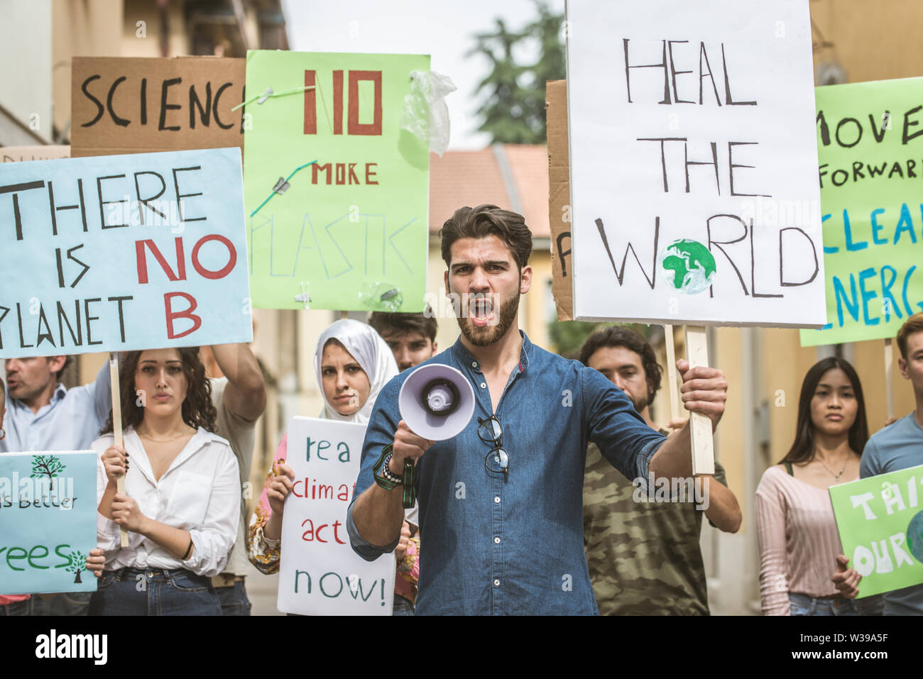 Group of activists is protesting outdoors - Crowd demonstrating against ...