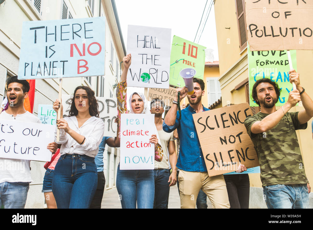 Group of activists is protesting outdoors - Crowd demonstrating against ...