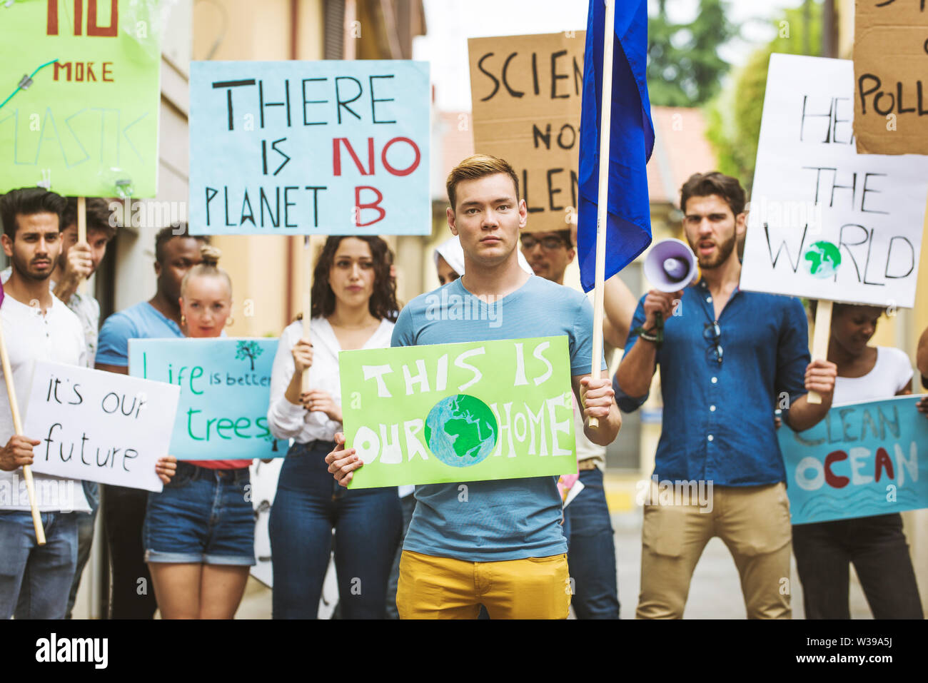 Group of activists is protesting outdoors - Crowd demonstrating against ...