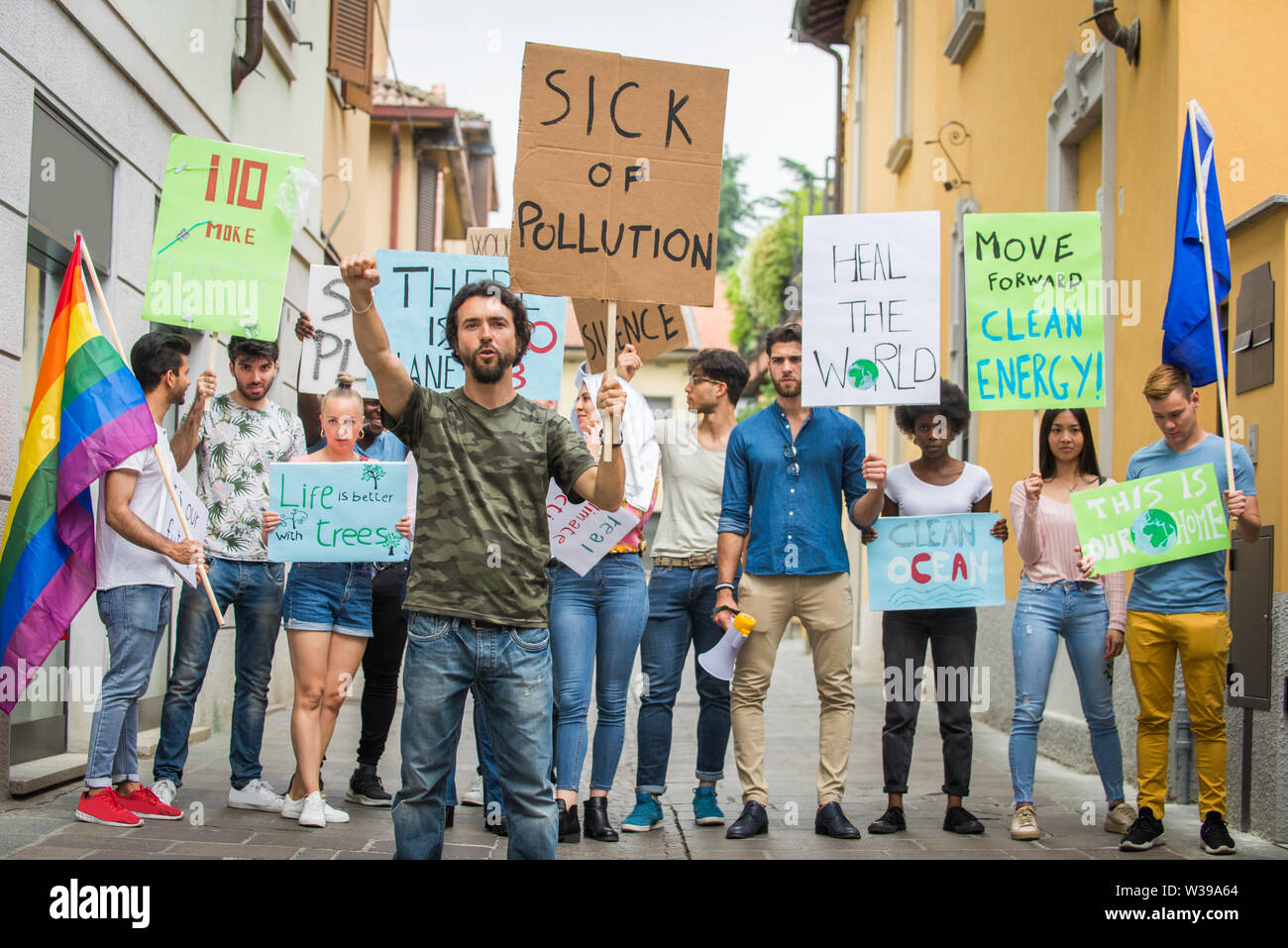 Group of activists is protesting outdoors - Crowd demonstrating against ...