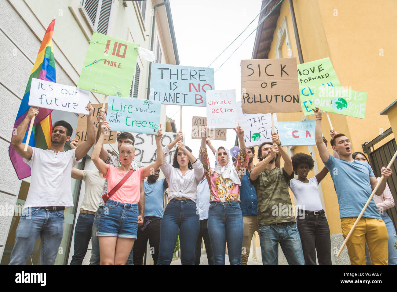 Group of activists is protesting outdoors - Crowd demonstrating against ...