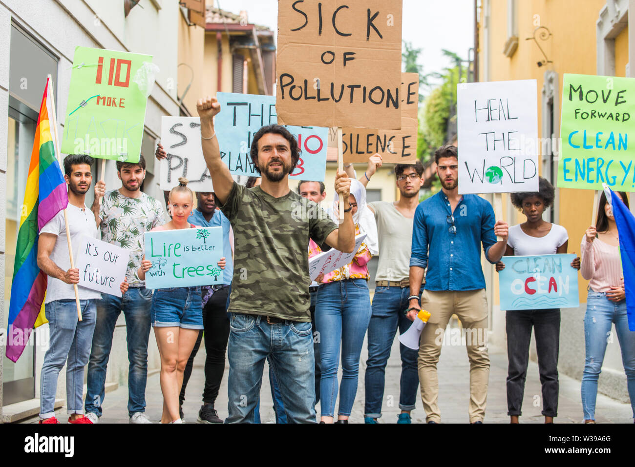 Group of activists is protesting outdoors - Crowd demonstrating against ...