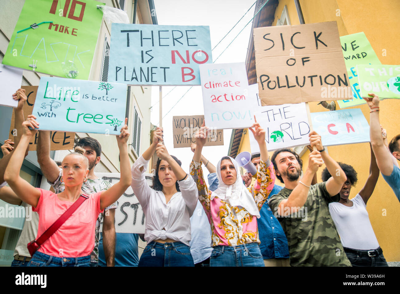 Group of activists is protesting outdoors - Crowd demonstrating against ...