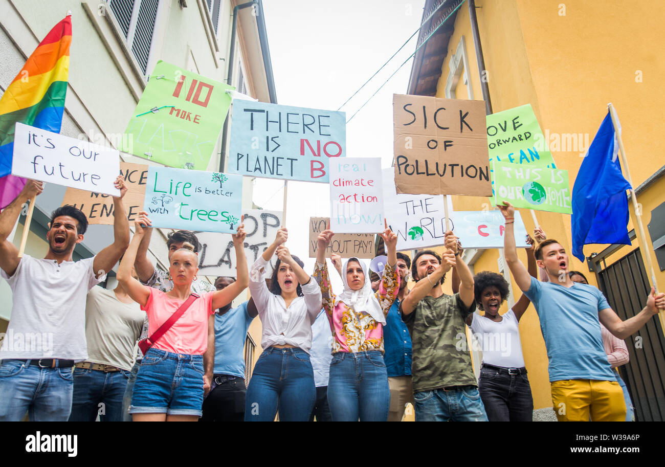 Group of activists is protesting outdoors - Crowd demonstrating against ...