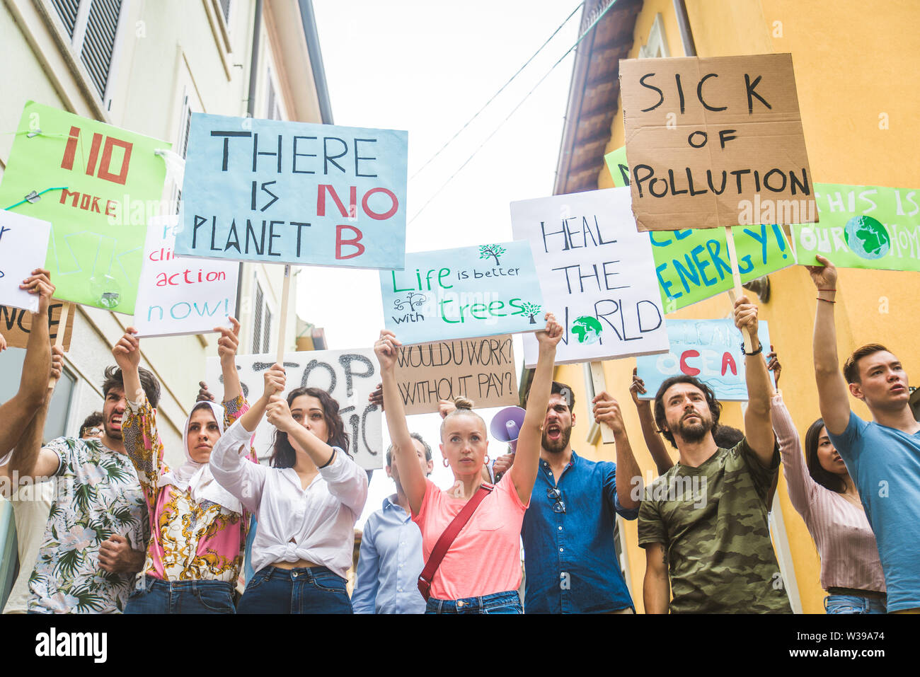 Group of activists is protesting outdoors - Crowd demonstrating against ...