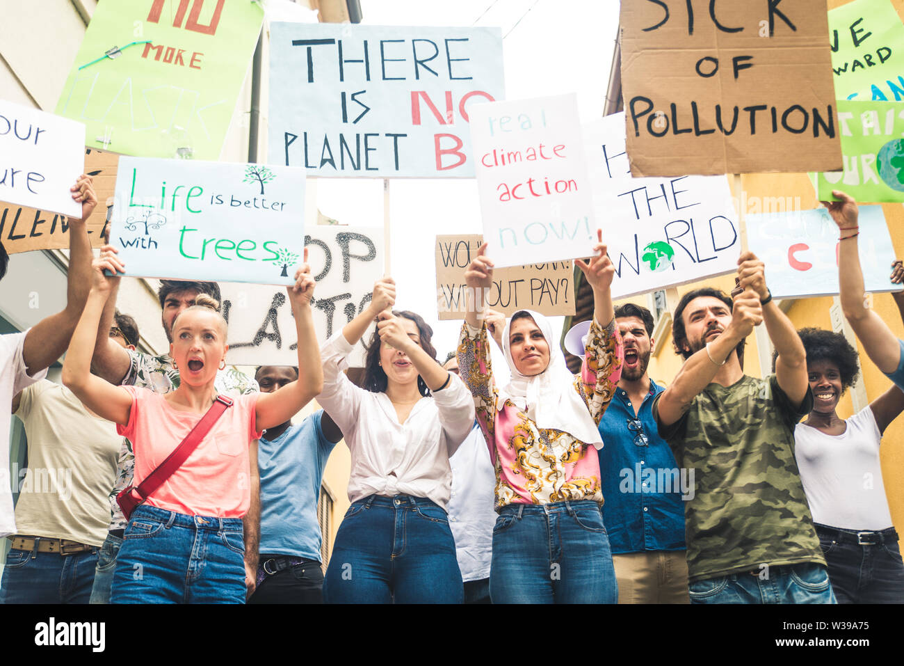 Group of activists is protesting outdoors - Crowd demonstrating against ...