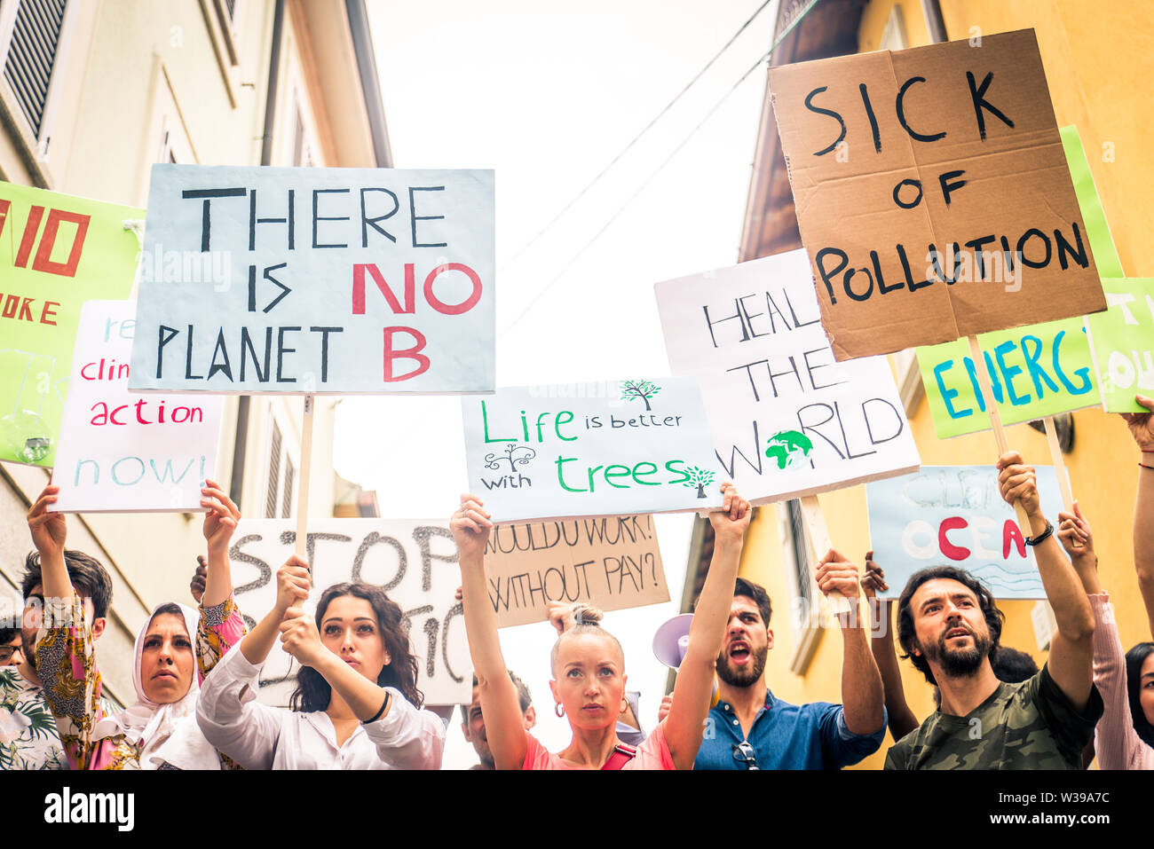 Group of activists is protesting outdoors - Crowd demonstrating against ...